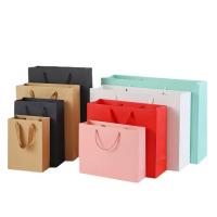 China Custom Logo Size Color Professional Made Kraft Paper Bags For Gift Packaging For Cloth for sale