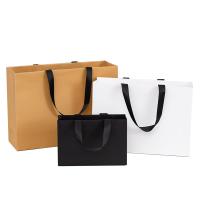 China Handmade Kraft Paper Bag Tote Bag With Thread Rope For Clothing Candles And Crafts Gravure Printing In Stock for sale