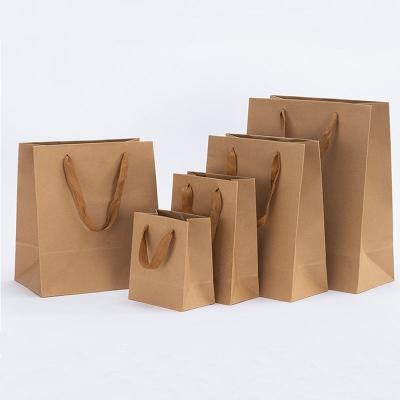 China Custom Luxury Cardboard Packaging Brown Kraft Gift Craft Shopping Paper Bag With Ribbon Handles for sale