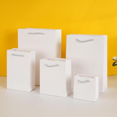 China Colorful Kraft Paper Packing Bags Ribbon Handle Strong Recycled Materials Offset Printed Logo For Gifts for sale