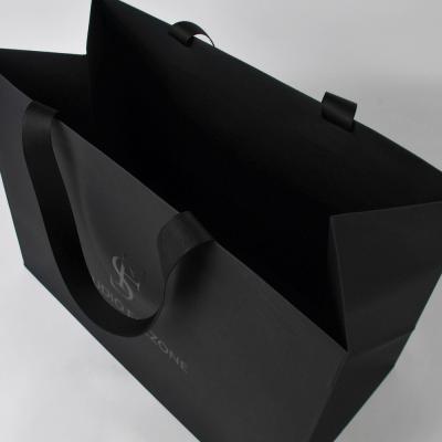 China ODM Fashion Boutique Durable Handle Packing Custom Logo Printed Shopping Paper Bag for sale