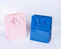 China Luxury Recyclable Kraft Paper Gift Bags Custom Printing Unique Design Wedding Gift Bags With Ribbon Handles Gold Foil Christmas for sale