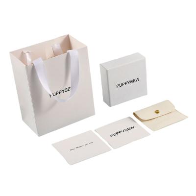 China Custom Logo Handmade Smooth Kraft Shopping Bag For Luxury Jewelry Gift Packaging Exclusive Paper Container for sale