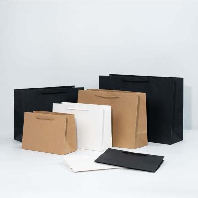 China Black In-Stock Customizable White Cardboard Paper Shopping Bags Custom Logo Paper Bag With Handle Black Craft Paper Bag for sale