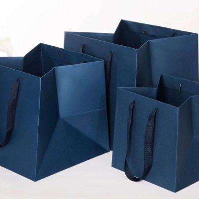 China Luxury DIY Kraft Paper Wedding Gift Bag Handmade Reusable Clothing Shopping Bags Black Handles for Supermarket for sale