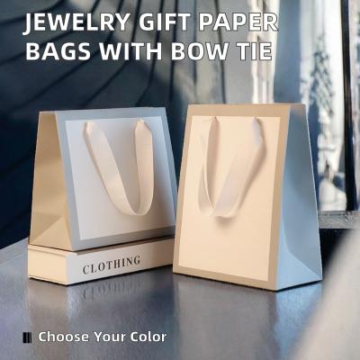 China Premium Custom Logo Paper Bag Strong Handles Eco Conscious Biodegradable Recyclable For Retail Shopping Gift for sale