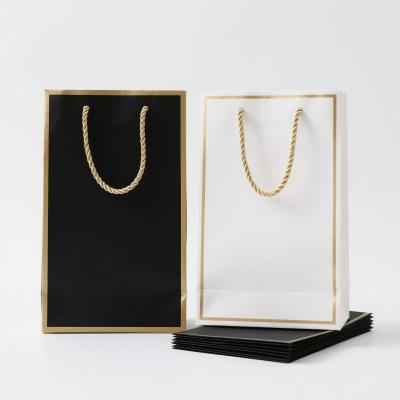 China White Card Paper Gift Bags With 3-Ply Rope Handles Black & White For Luxury Gifting & Branding for sale