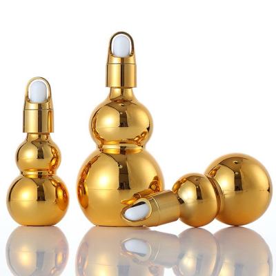 China Golden Gourd Glass Dropper Bottles 10ml 30ml Empty Essential Oil Bottles with Customizable Colors for sale