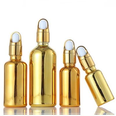China Gold Plated Glass Dropper Bottles 10ml 30ml 50ml 100ml Essential Oil Packaging for sale