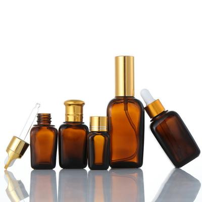 China Cube 30ml 100ml Square Glass Bottles Travel Cosmetic Containers with Dropper for sale