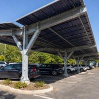 China Heavy Duty Galvanized Steel Metal Covered Parking Structures With Solar Panel Mounting for sale