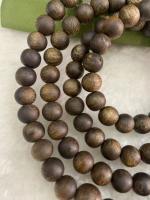 China Natural Agarwood Beads Crafted for Meditation and Spiritual Featuring Smooth Texture Long Lasting Aroma and Elegant Appearance for sale