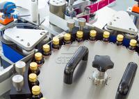 China Dual Label Head Vertical Round Bottle Self Adhesive Labeling Machine High Speed for sale