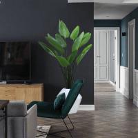China Indoor Bonsai Artificial Landing Plant Simulated Green Tropical Traveler Palm for sale