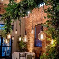 China Anti Aging Artificial Potted Plants Green Leaf Bar Music Restaurant Hanging Window Ceiling for sale