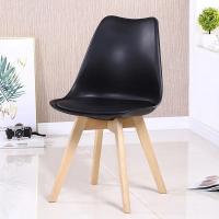 China Yellow Upholstered Leather Dining Chairs PP Plastic Modern Dining Chairs With Wood Legs for sale