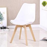 China Yellow Upholstered Leather Dining Chairs PP Plastic Modern Dining Chairs With Wood Legs for sale