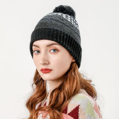 China COMMON Custom Warm Winter Hats Women Jacquard Knit Black Beanie Hats With Pompoms Cap for sale