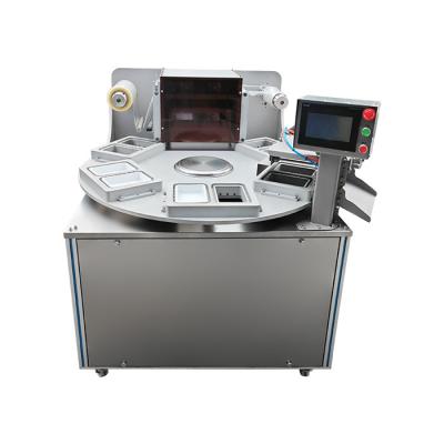 China Rotary Commercial Gas Flush Food Sealing Packing Machine 6 Trays 380V for sale