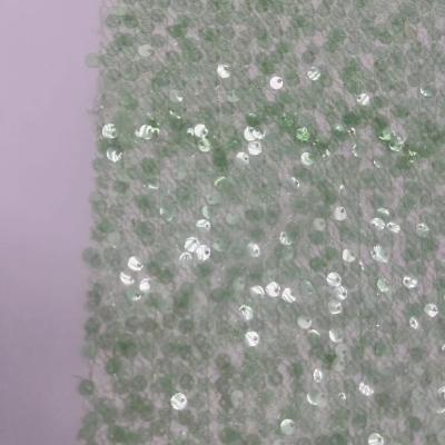 China Special Mesh Sequins Embroidery Fabric 100% Polyester Transparent Green Unique For Women Party Dresses for sale