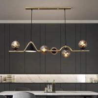 China Gold Living Room Chandelier Glass Ball Hanging Lamp Modern Gold LED Pendant Light for sale