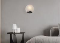 China Modern wall lamp round glass bedroom bedside lamp designer light luxury lamp Nordic living room background wall lamp for sale