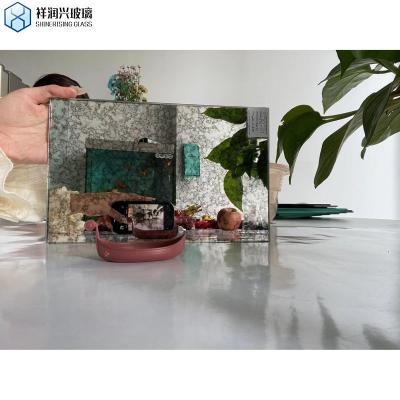 China Decorative Wall Mirror with Artistic Design and Antique Mirror Glass in Silver Finish for sale