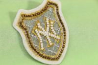 China Stylish Silver Gold Metallic Embroidery Badge With White Felt Ground Beads Around For Caps Shoes for sale