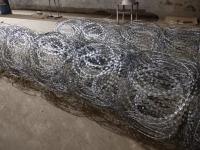 China Galvanized Concertina Razor Wire Fence - Single Coil, Crossed & Flat Warp Security Barrier Options for sale