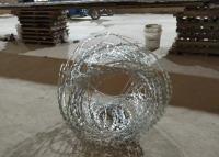 China Hot Dipped Galvanized BTO-18 Concertina Coil Wire Flat Wrap Razor Barbed Wire for sale