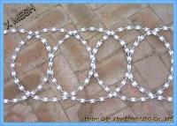 China 450mm Coil Diameter BTO-22 Galvanized Concertina Razor Wire with 56 Loops for High-Security Perimeter Protection for sale