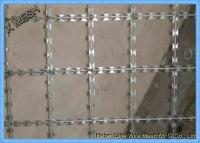 China Stainless Steel Crossed Coil Concertina Single Coil Razor Barbed Wire for sale