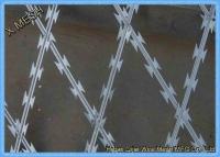 China Stainless Steel Crossed Coil Concertina Single Coil Razor Barbed Wire for sale