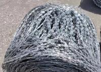 China Hot Galvanized BTO22 Razor Wire Flat Wrap - 22mm Barb Length, 450-980mm Diameter for Farm Security Fencing for sale