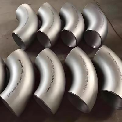 China DIN Standard Copper Nickel Elbow Forging Method High Pressure Elbow Connector Suitable for Oil Refinery Applications for sale