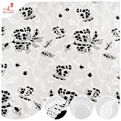 China Hot Sales White Embroidery Floral Fabric Soft Hollow Out Eyelet Polyester Embroidered Fabric for sale