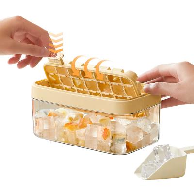China Multi Function 64 Cubes Fridge Ice Cube Tray With Large Bin And Lid for sale