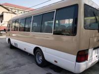 China LHD Steering Drive Used Toyota Coaster Bus  brown color Leather Seat 23 - 30 Seats Bus 7.50R16 Tyre Optional Color for sale