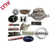 China Custom 3D Metal Car Badges Black Gold Silver Auto Emblems with Your Logo 75x35mm for sale