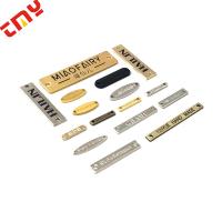 China Custom 2 Holes Engraved Metal Plate Logo Sewing Zinc Alloy Garment Label Tags 1mm Thickness for Clothing for sale