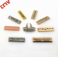 China Custom 2 Holes Engraved Metal Plate Logo Sewing Zinc Alloy Garment Label Tags 1mm Thickness for Clothing for sale