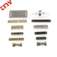 China Custom 2 Holes Engraved Metal Plate Logo Sewing Zinc Alloy Garment Label Tags 1mm Thickness for Clothing for sale
