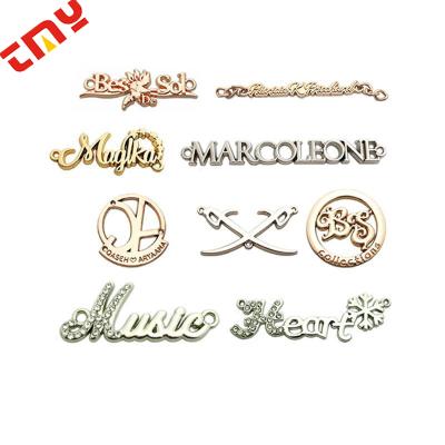 China Custom Engraved Metal Clothes Tags 45x13mm Personalized Logo Label Accessories for Apparel Branding for sale