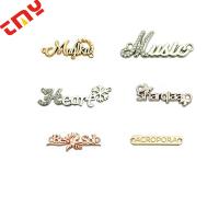 China Custom Engraved Metal Clothes Tags 45x13mm Personalized Logo Label Accessories for Apparel Branding for sale