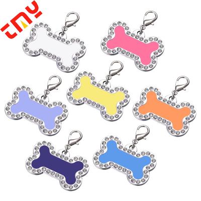 China Crystal Dog Tag Bone Shape Metal ID Tag with Rhinestone 50x30mm Customizable for sale