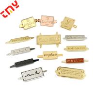 China Custom Zinc Alloy Metal Logo Labels Name Tags for Bags Clothes 0.5-1mm Thick for sale
