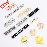 China Custom Zinc Alloy Metal Logo Labels Name Tags for Bags Clothes 0.5-1mm Thick for sale