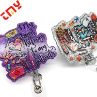 China Custom Acrylic Badge Reel Toppers 32mm Funny Cartoon Glitter Charms for Nurses Medical Staff for sale