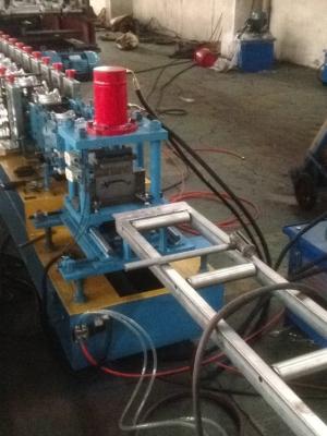 China Hydraulic Quick Punching Metal Shutter Door Roll Forming Machine Single Profile Holes for sale