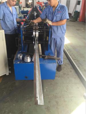 China Rolling Speed 12 - 15m/min Fly Saw Cutting Metal Shutter Door Roll Forming Machine PLC Control System for sale